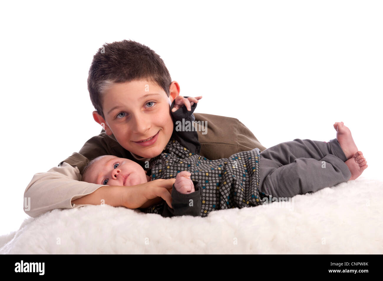 big brother with baby sister. isolated on white background Stock Photo ...