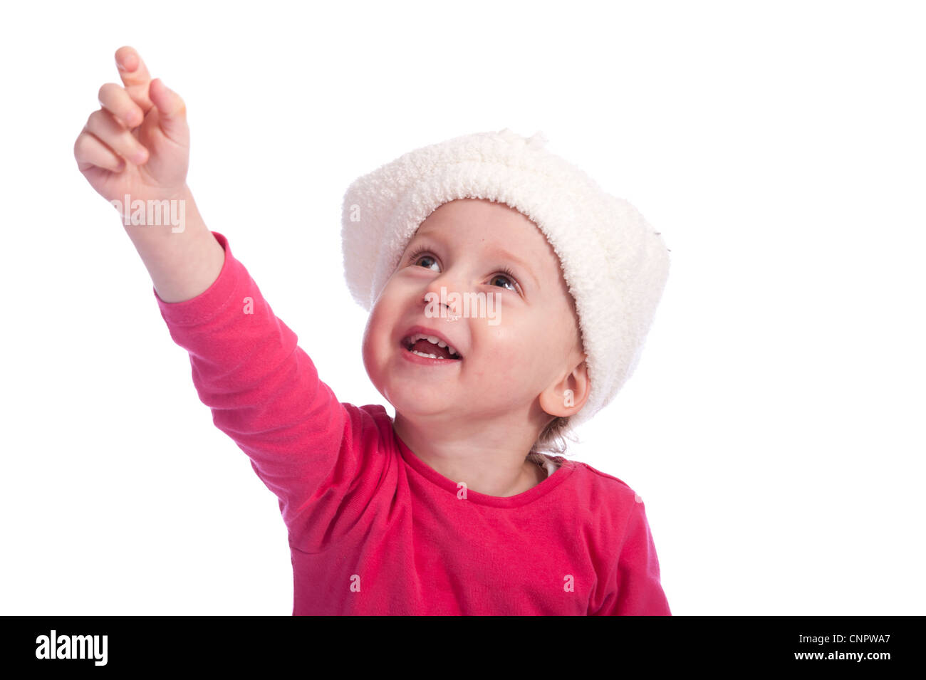 little girl looking up trying to grab something on white background ...