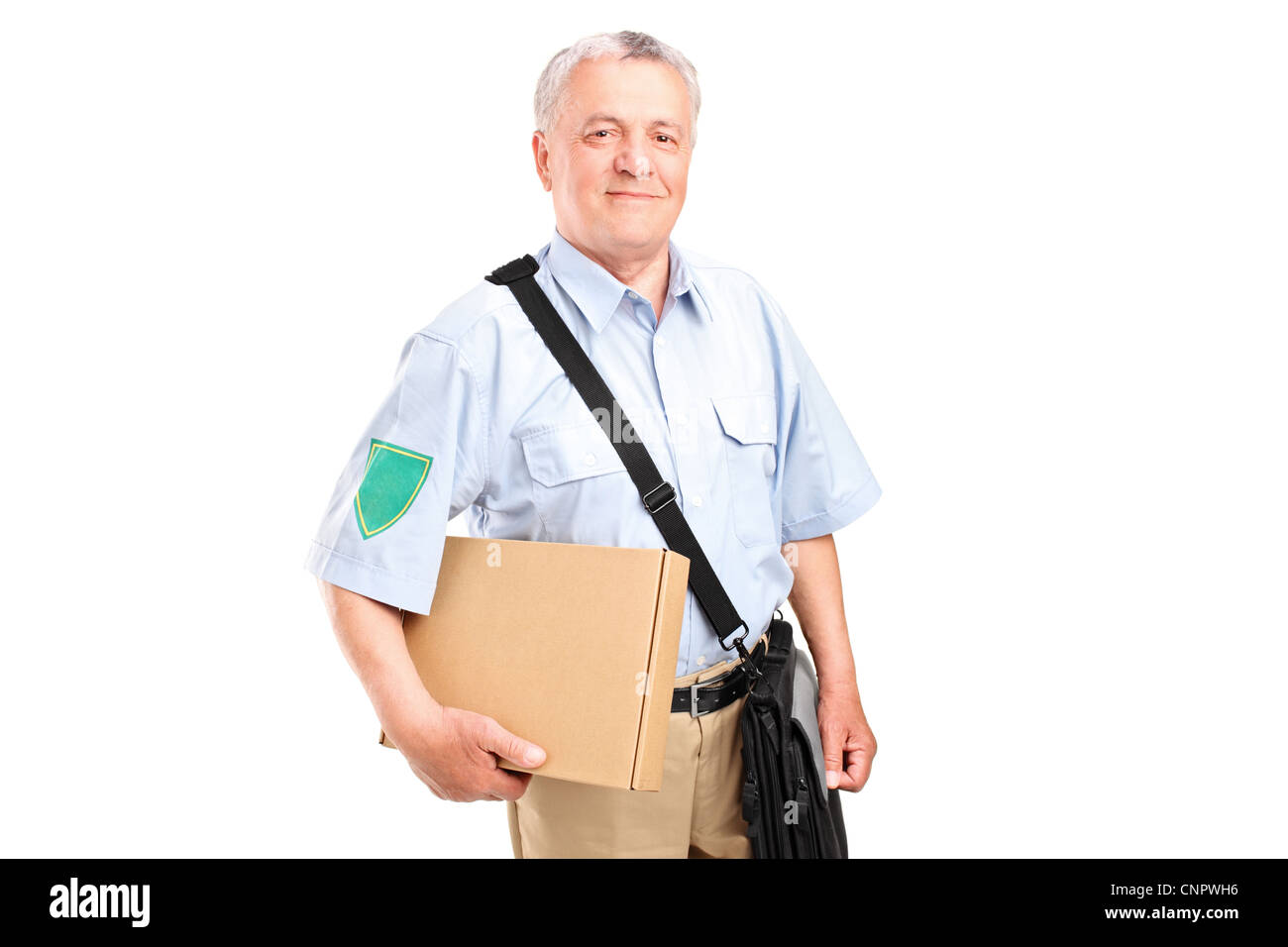 A mature postman delivering a box isolated on white background Stock ...
