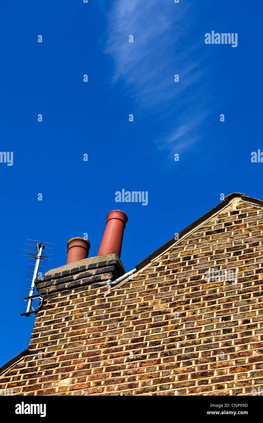 Gable-end of Terraced House Showing Chimney Pots against Blue Sky Stock ...