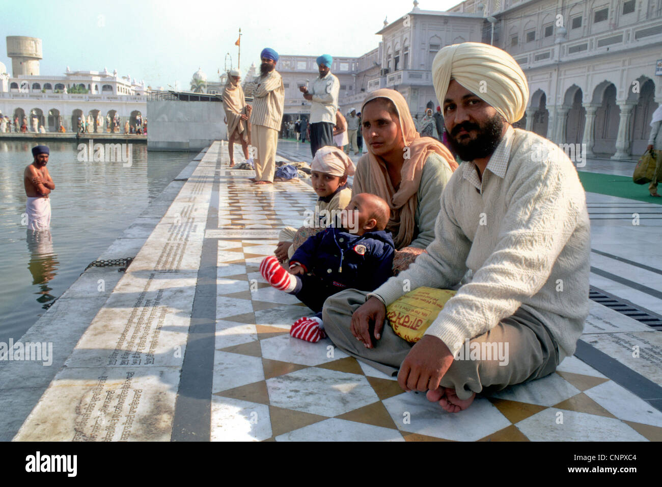 Sikh family at Golden Temple in Amritsar, India. Main place of worship ...