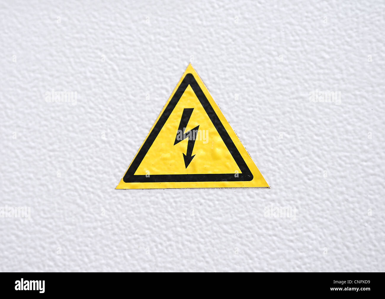 Warning Danger sign on metal textured background Stock Photo - Alamy