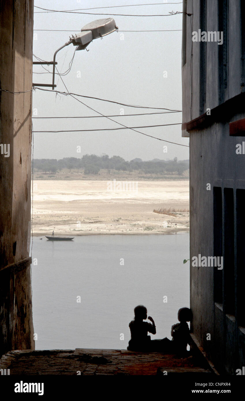 Ganges view from an alley at the ancient Indian city of Benares ...