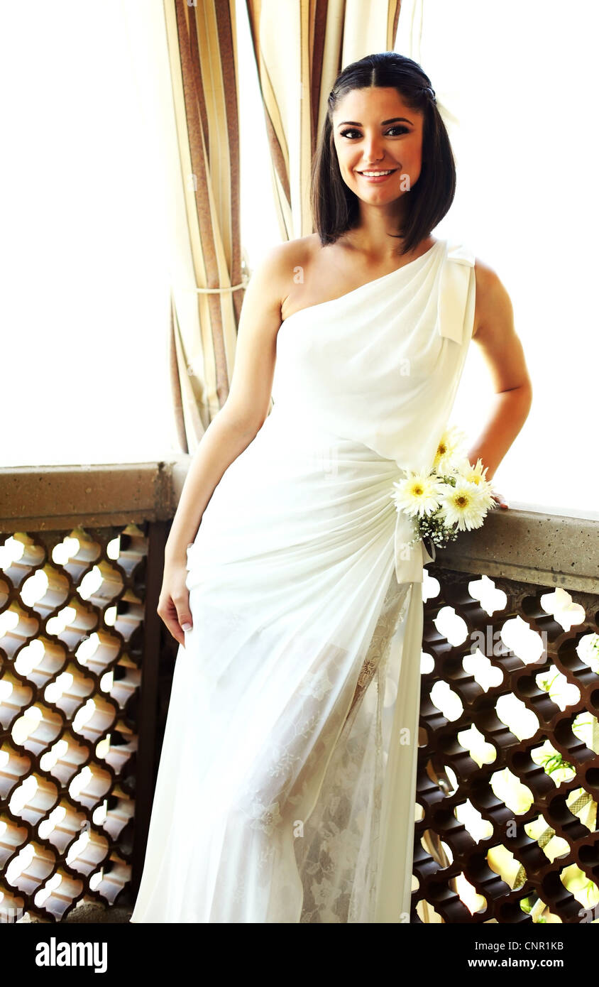 Young happy smiling bride with flowers, wedding day Stock Photo - Alamy