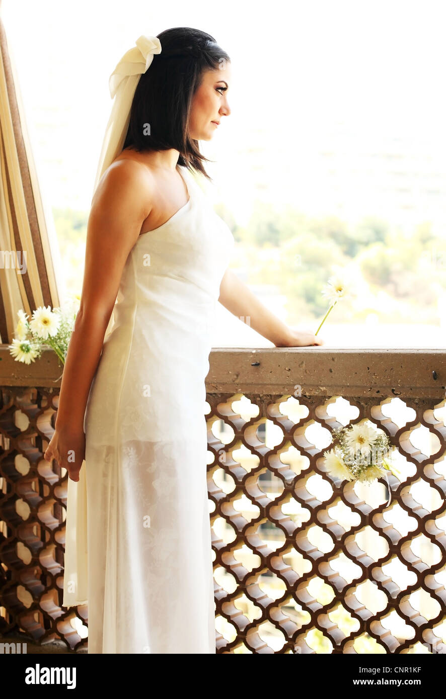 Young happy smiling bride with flowers, wedding day Stock Photo - Alamy
