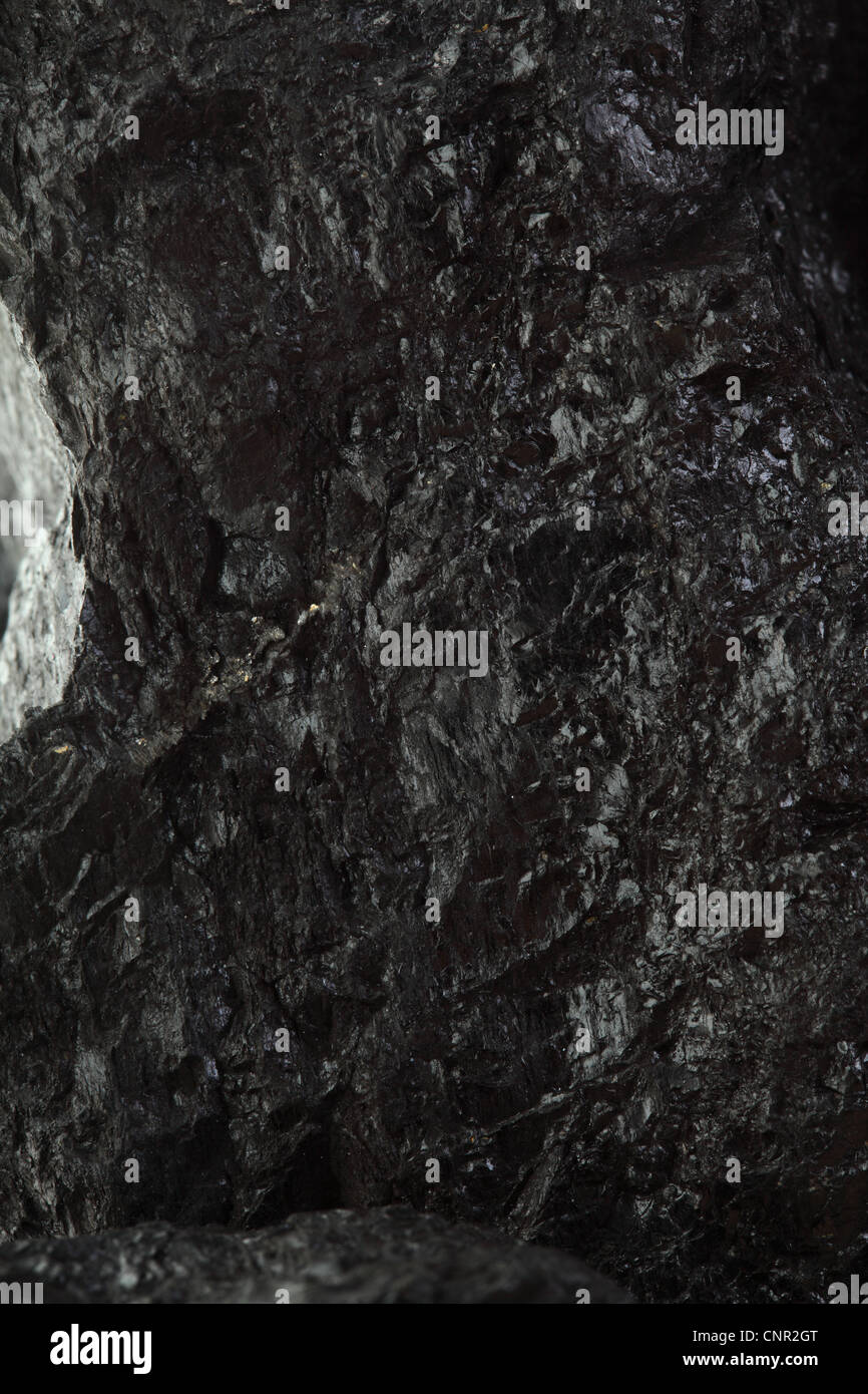 Pieces of black fossil coal texture background Stock Photo - Alamy