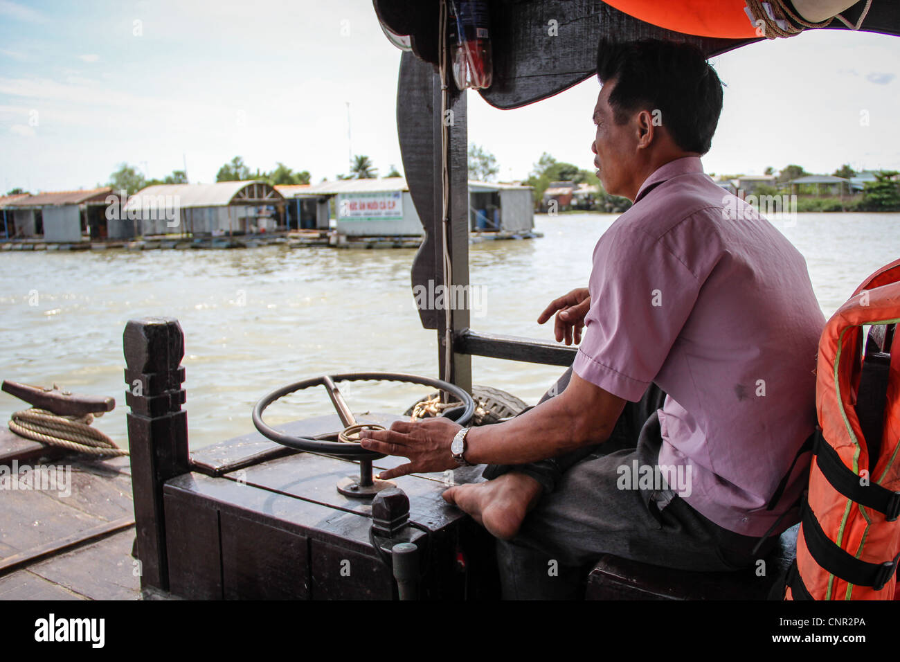 Boat driver in Mekong Delta, Vietnam Stock Photo - Alamy