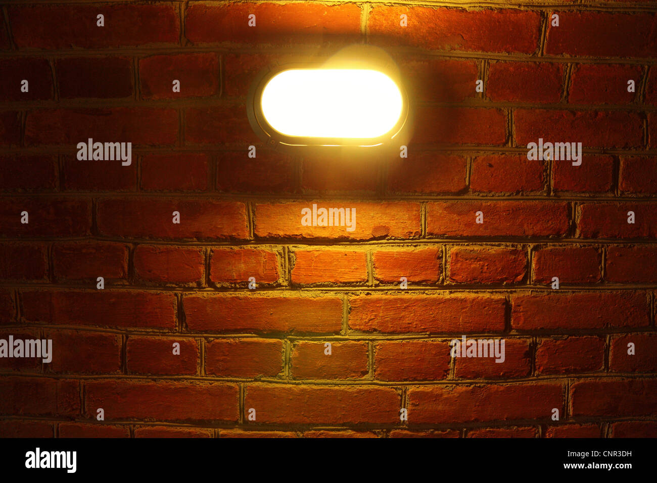 Old red brick wall with street light background Stock Photo - Alamy