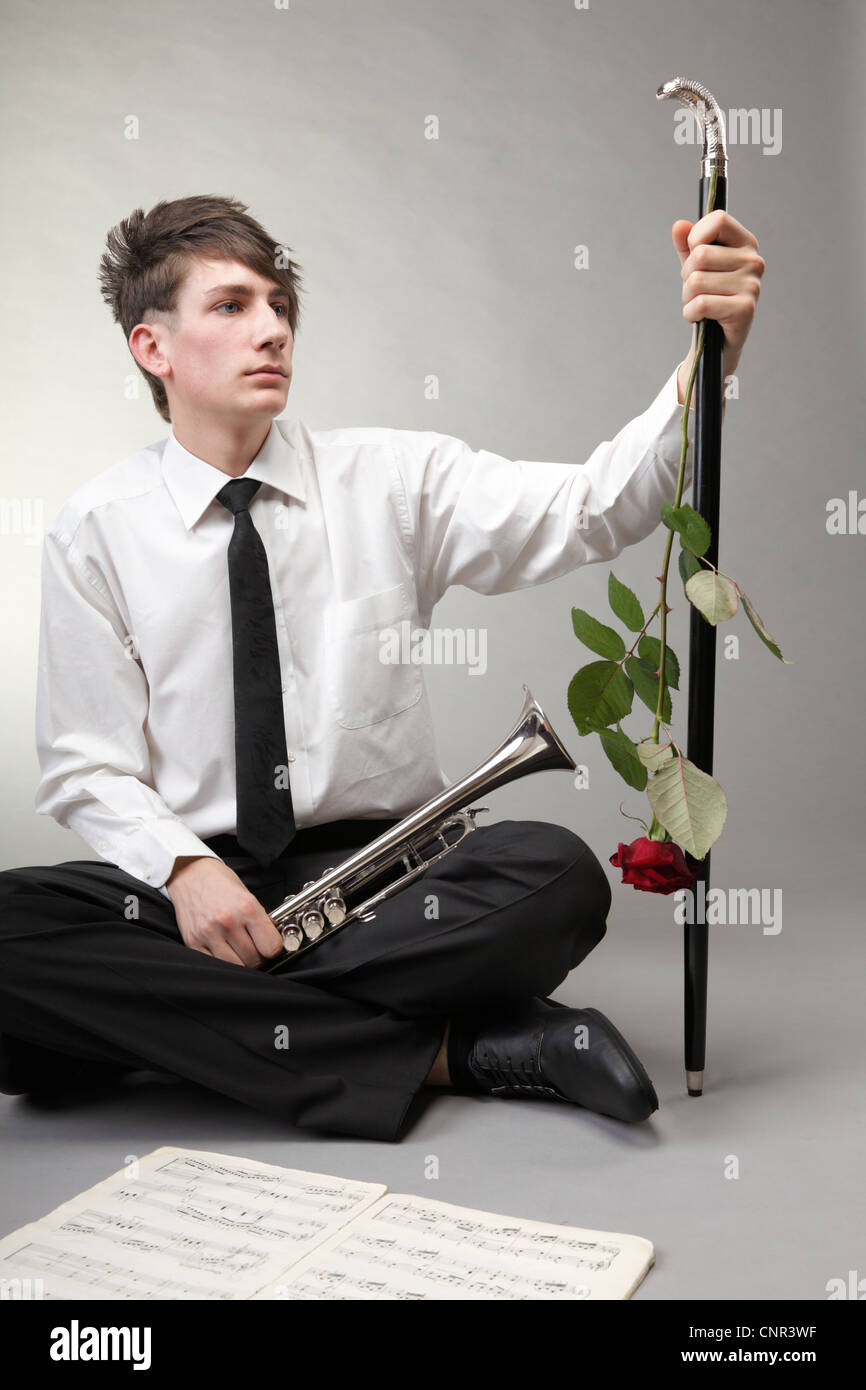 Portrait of a young jazz man and Trumpet grey Stock Photo - Alamy