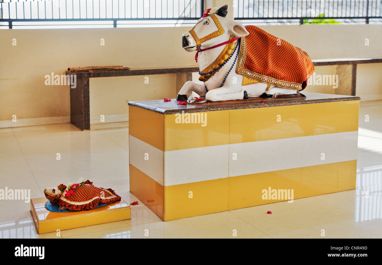 Interior of hindu temple, sculpture of sacred cow, mouse, turtle ...