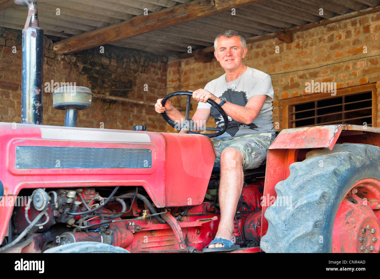 Horizontal portrait of a happy farm worker tractor driver operator ...