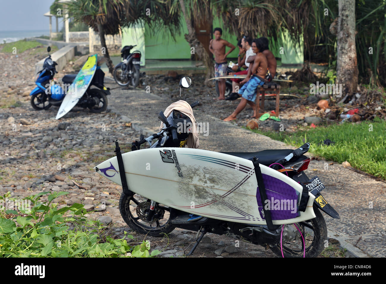 Surfers relaxing at Cimaja Beach in West Java, Indonesia Stock Photo ...