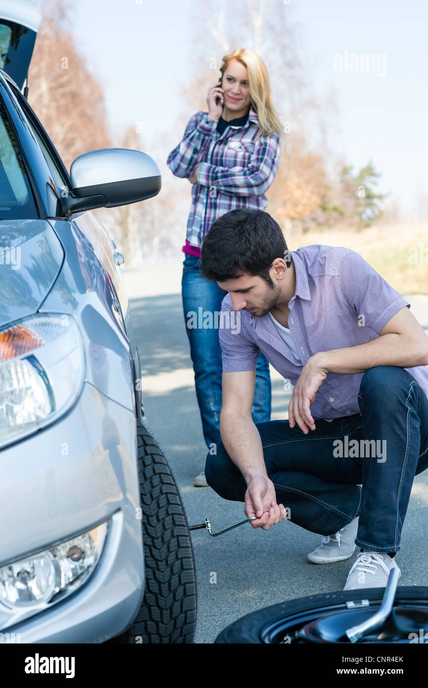 Car wheel change road man woman hi-res stock photography and images - Alamy