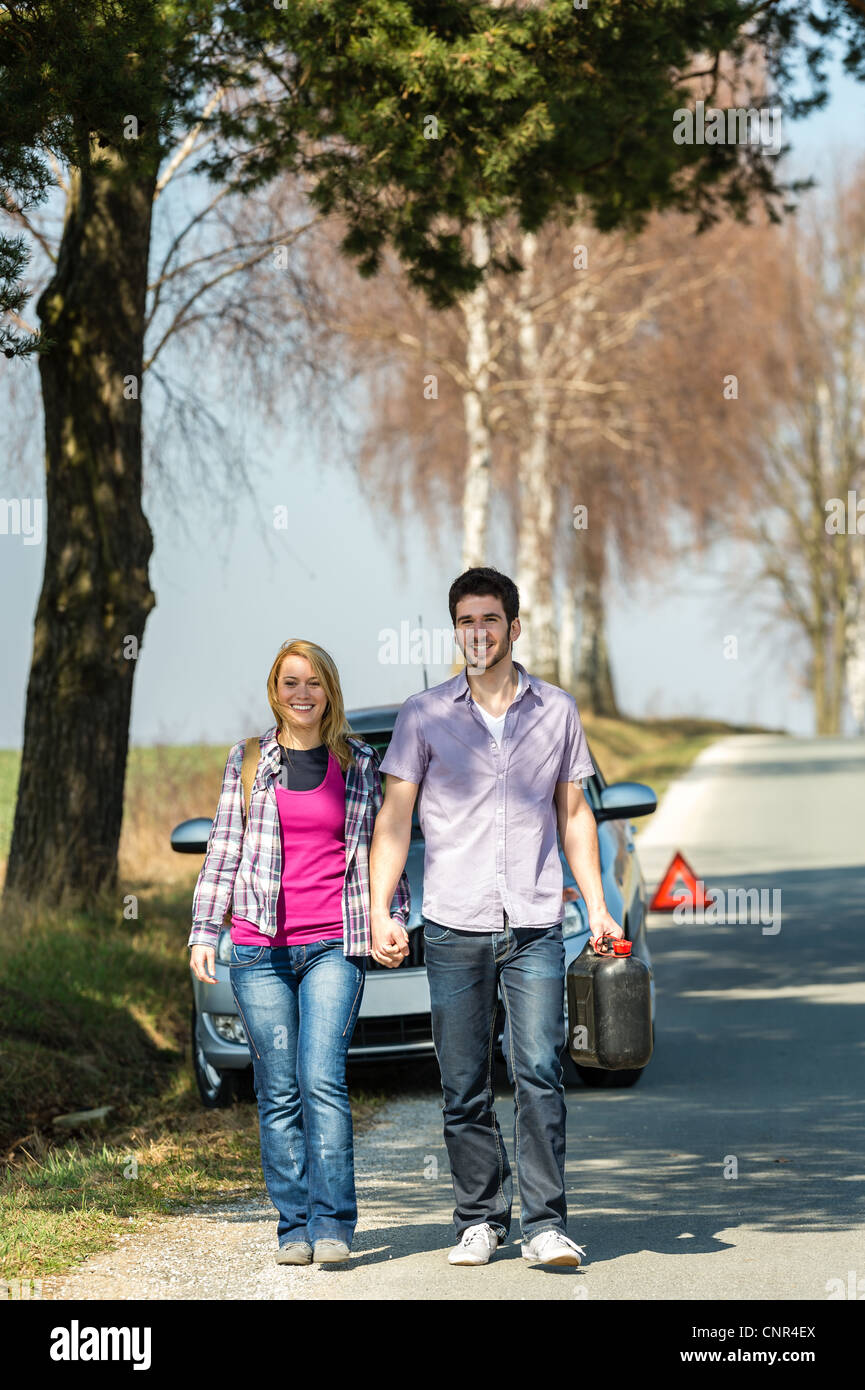 Running out of gas people walking for petrol can Stock Photo - Alamy