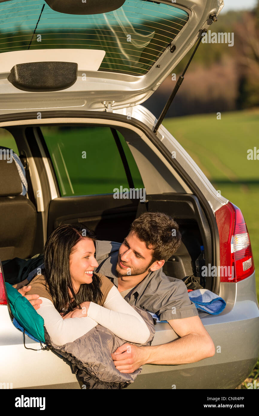 Camping young couple hugging together in car summer sunset Stock Photo ...