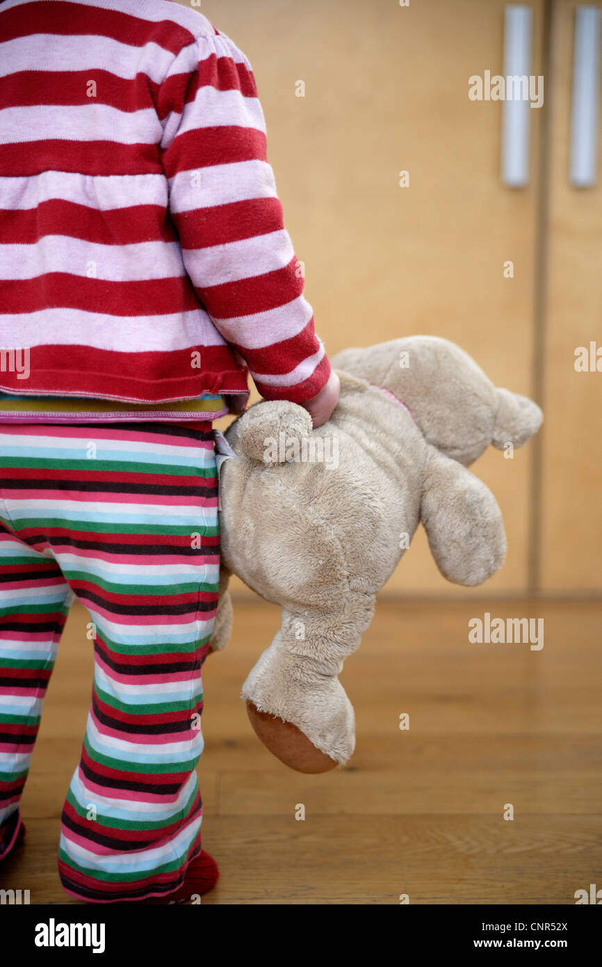 Rear view of the lower section of a 3-4 year old child in short ...