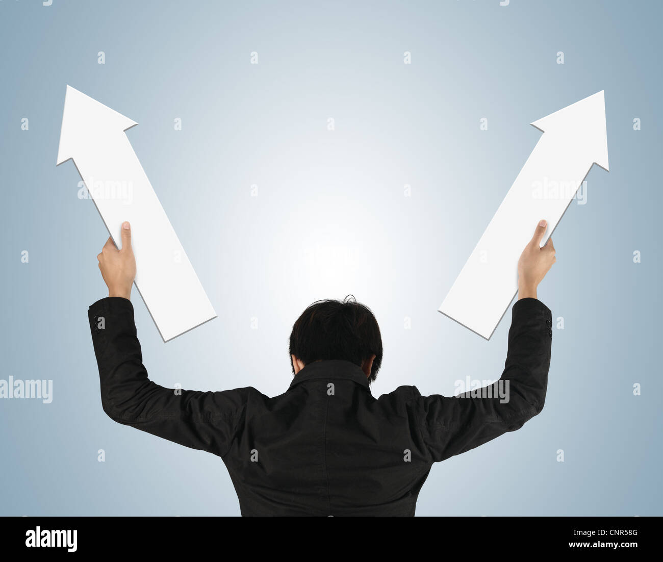 hands holding white arrow sign (path in side Stock Photo - Alamy