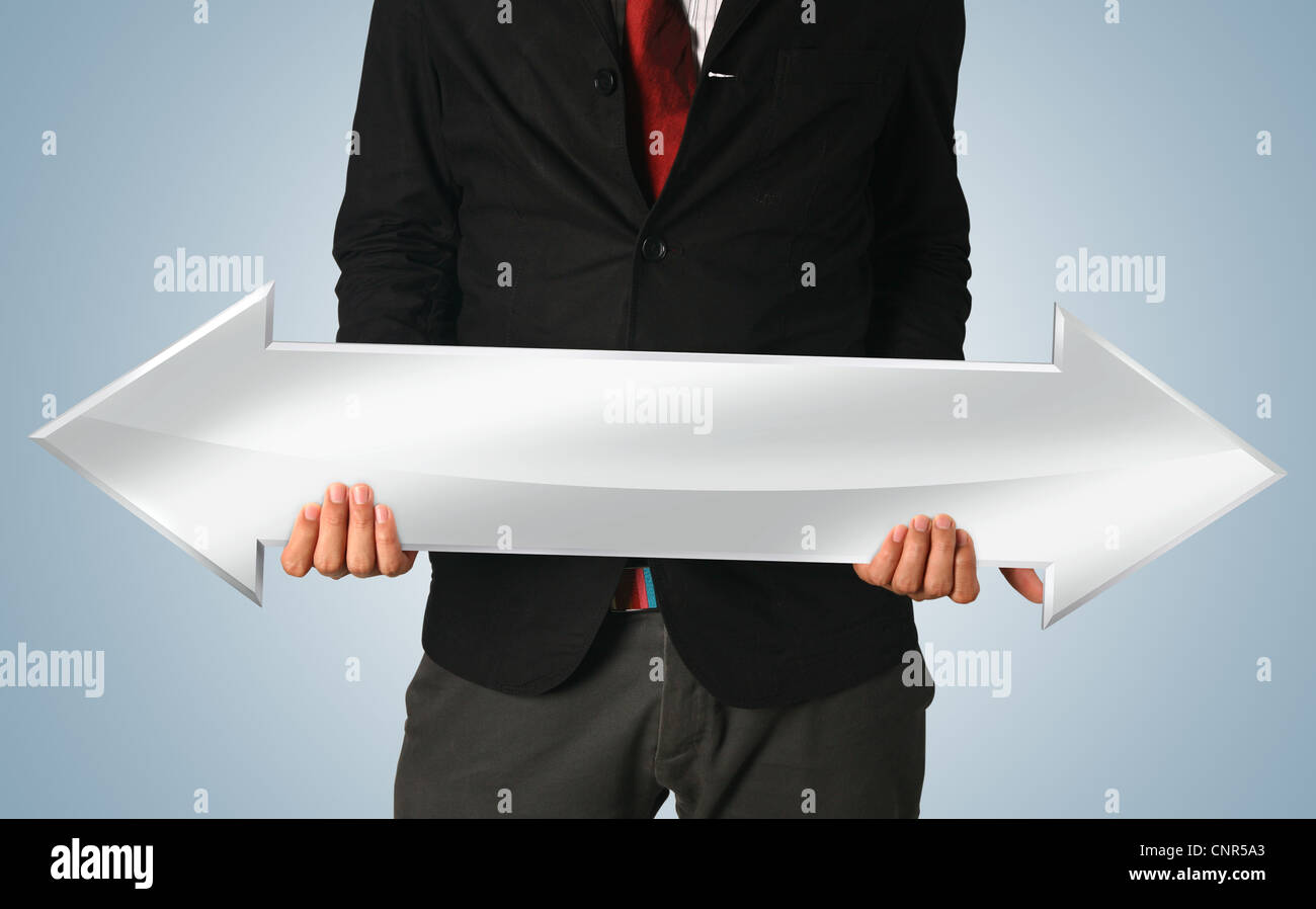 hands holding white arrow sign (path in side Stock Photo - Alamy