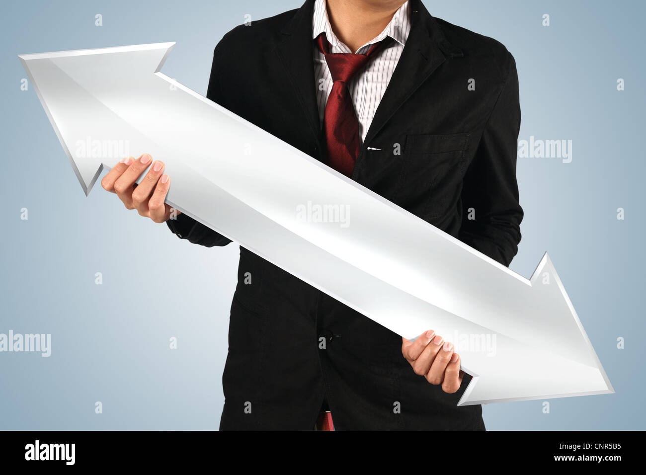 hands holding white arrow sign (path in side Stock Photo - Alamy