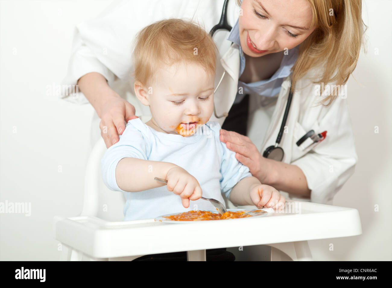 doctor with baby Stock Photo - Alamy