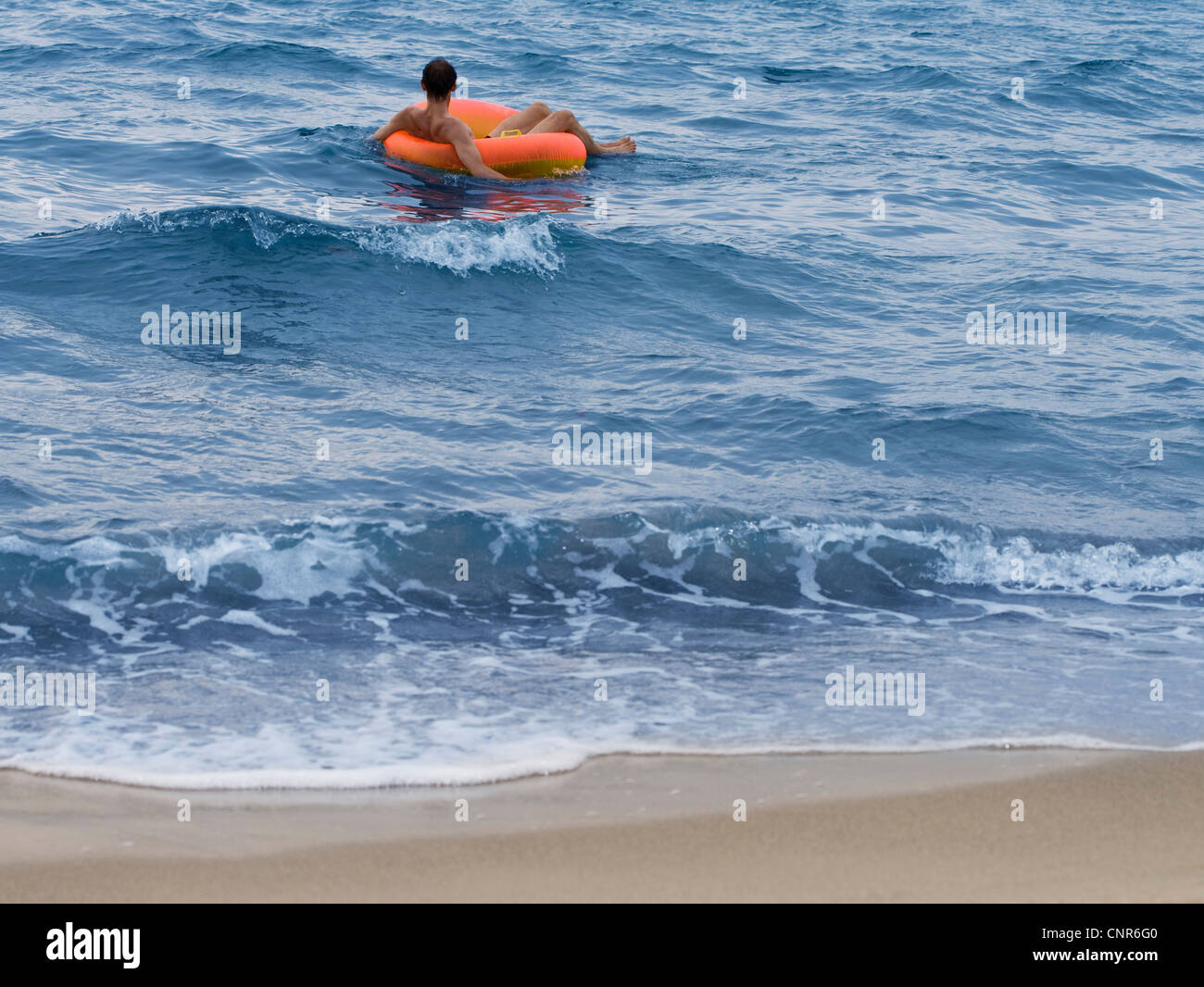 Sea inner tube men hi-res stock photography and images - Alamy