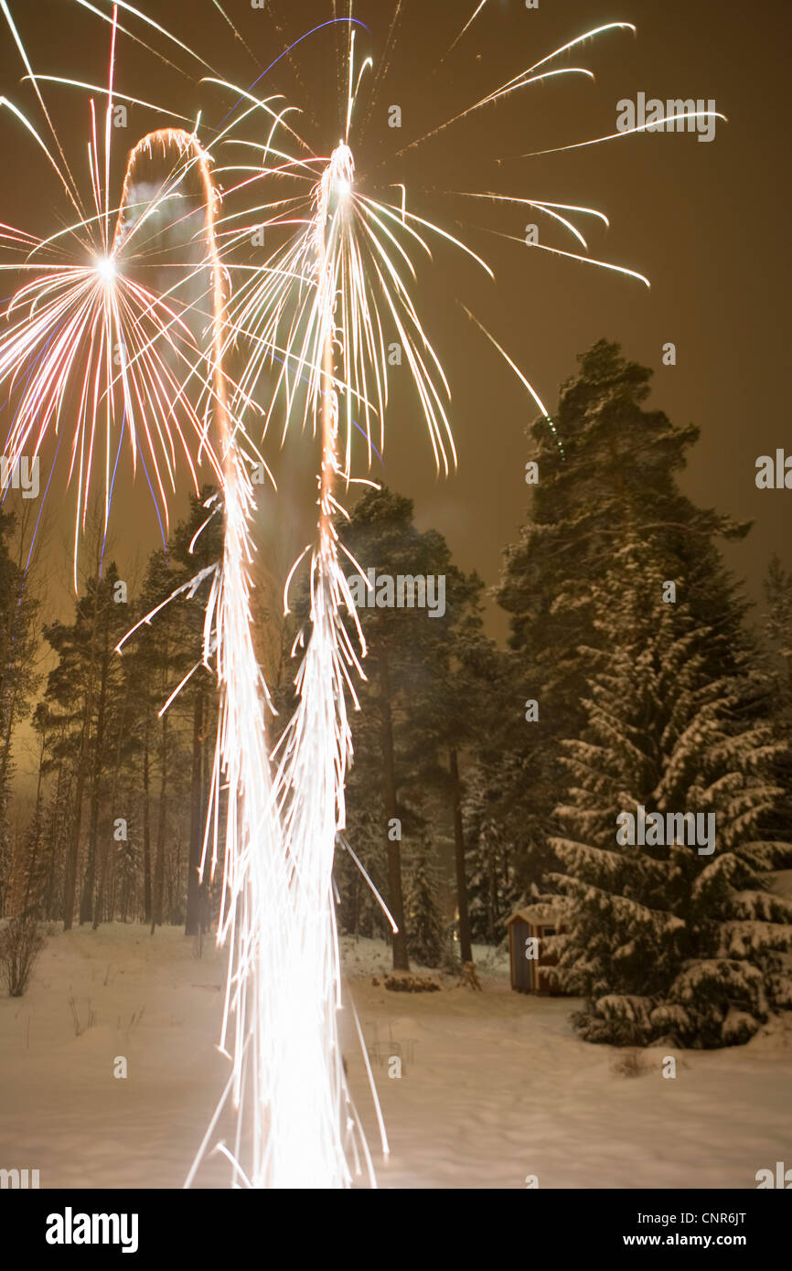 Fireworks in snowy field Stock Photo - Alamy
