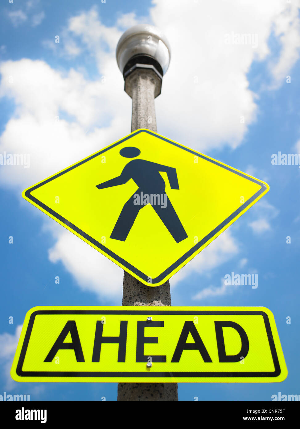 Crossing road sign against blue sky Stock Photo - Alamy