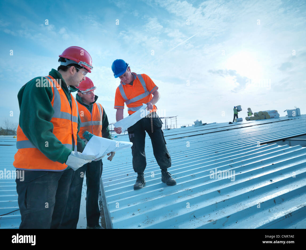 Worker reading blueprints on site hi-res stock photography and images ...