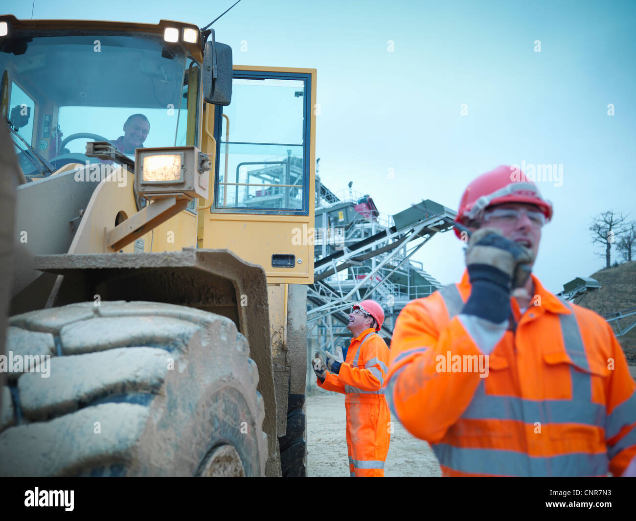 Worker driving industrial digger hi-res stock photography and images ...