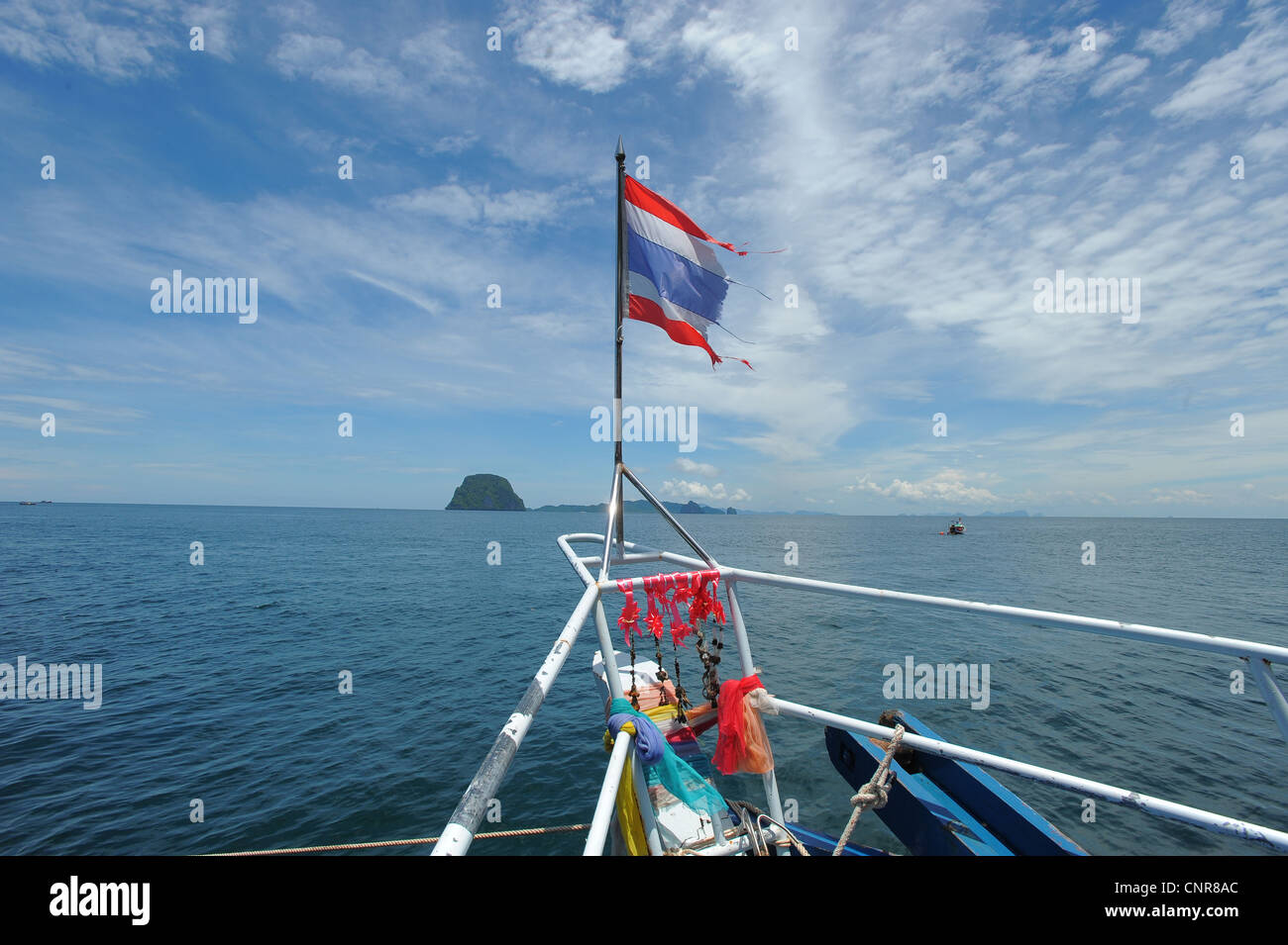 fishing boat flying the thai flag, the island of koh mook (also known ...