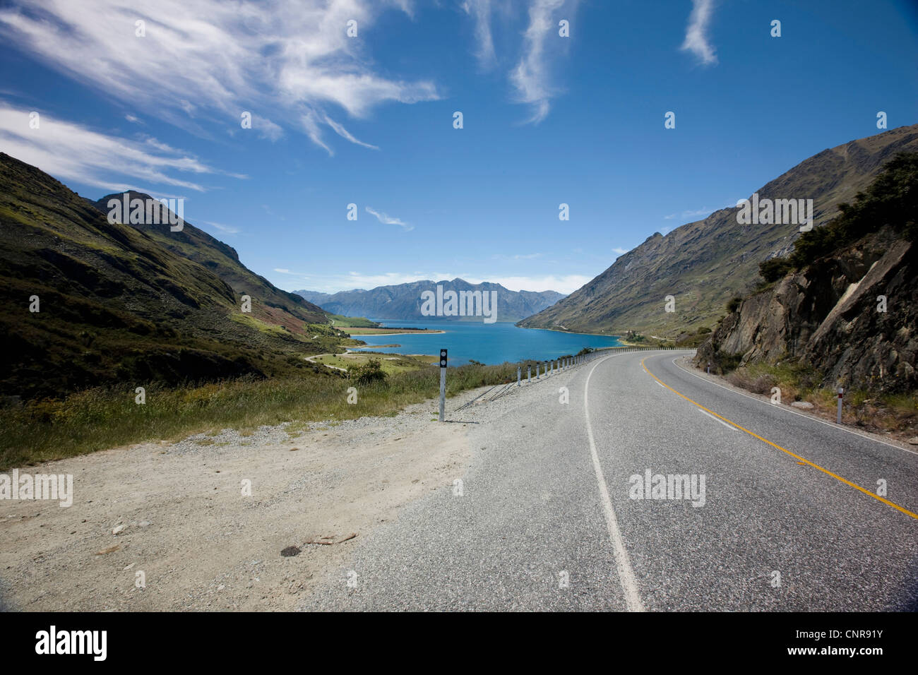 Rural road winding through mountains Stock Photo - Alamy