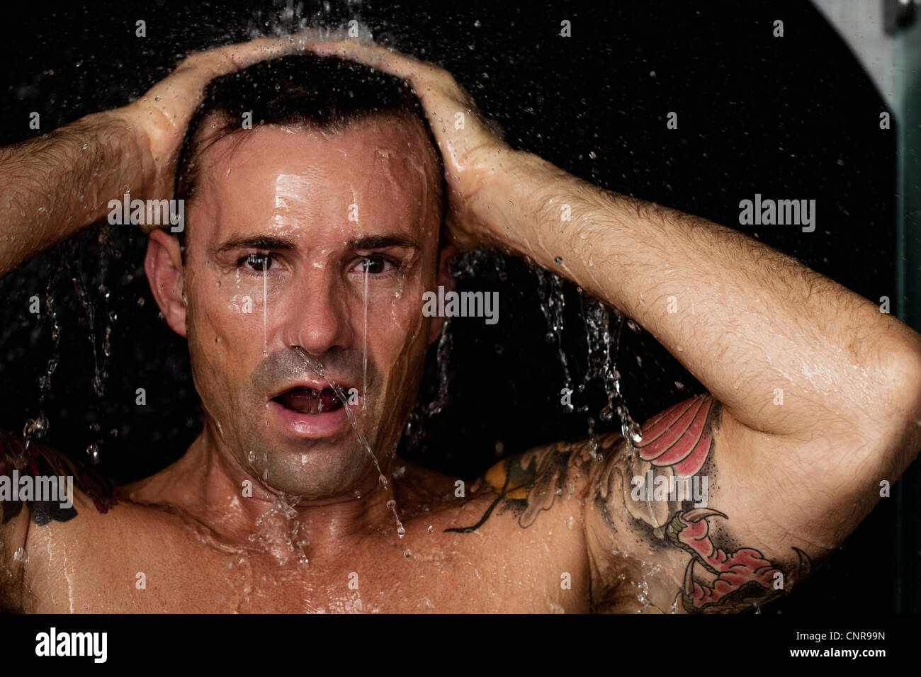 Man washing his hair in shower Stock Photo - Alamy