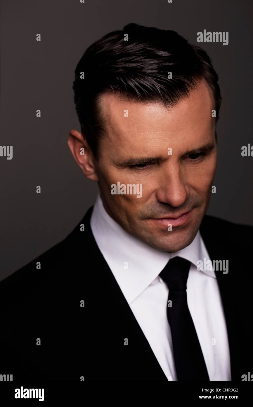 Close up of businessman’s frowning face Stock Photo - Alamy