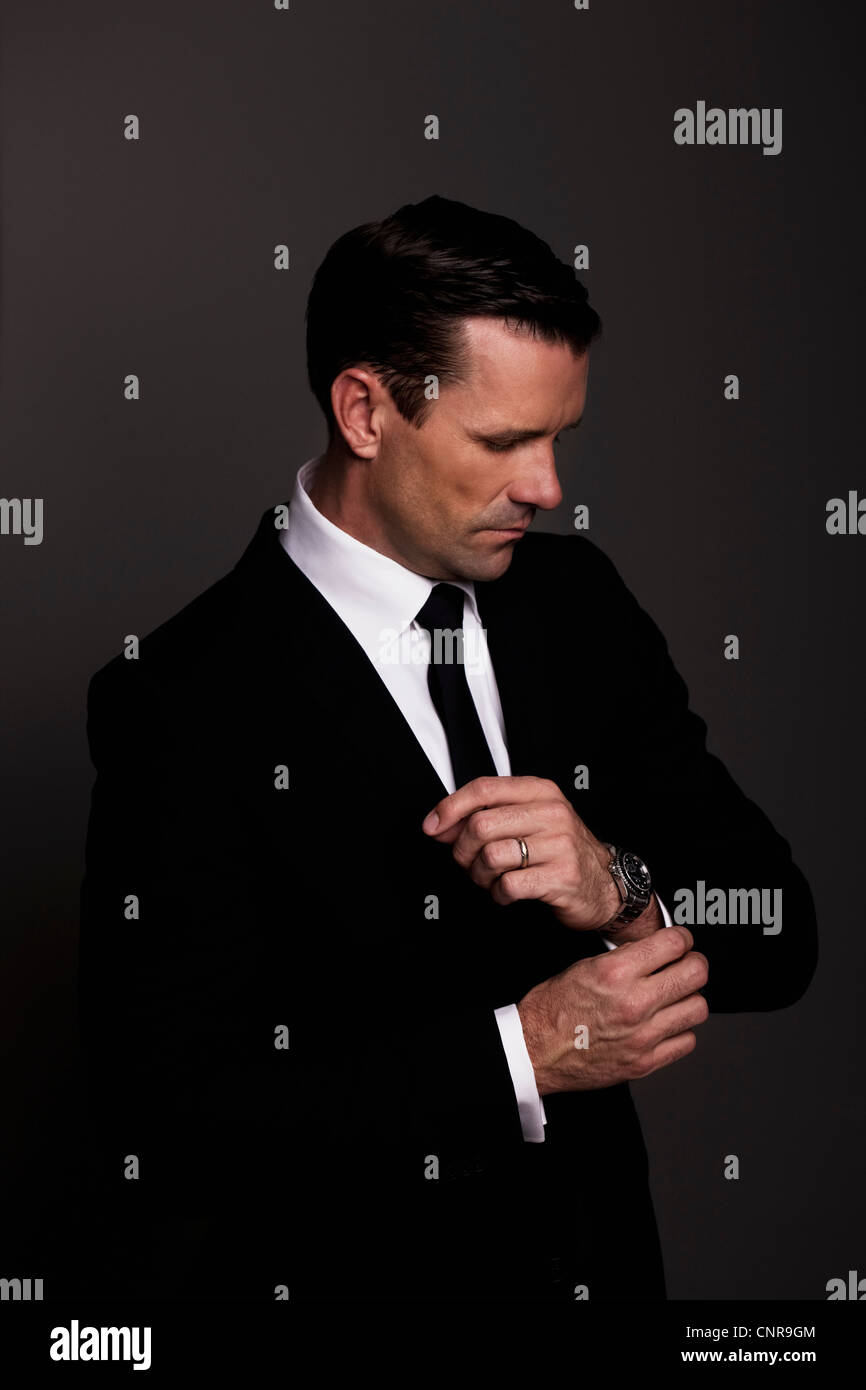 Man adjusting cuffs hi-res stock photography and images - Alamy