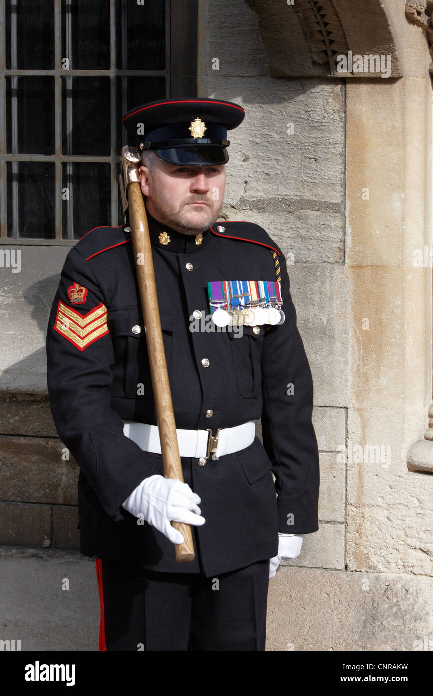 A solider from 23 Pioneer Regiment stands with a ceremonial axe as the ...