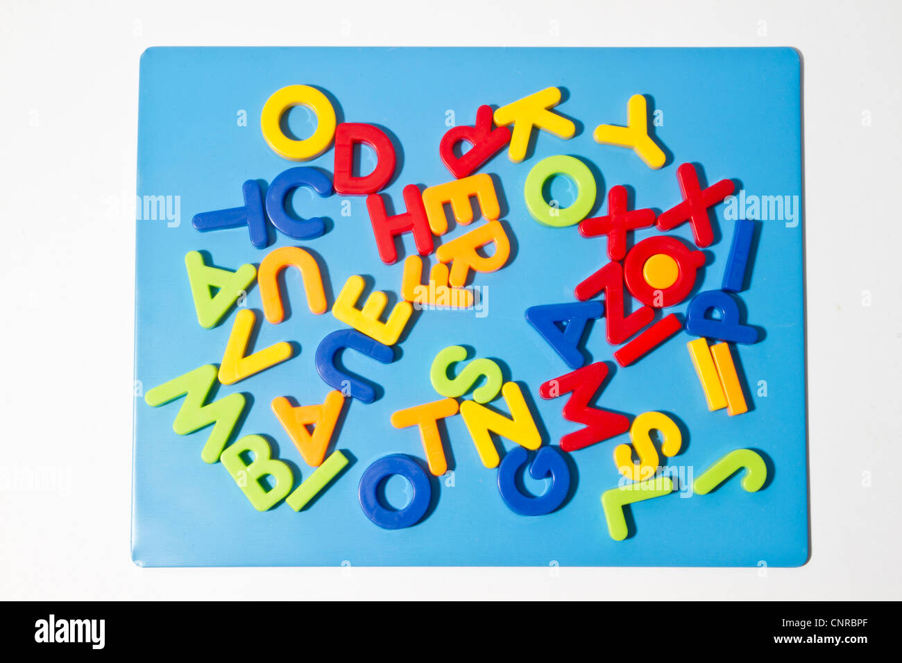 Letter magnets closeup on white background Stock Photo - Alamy