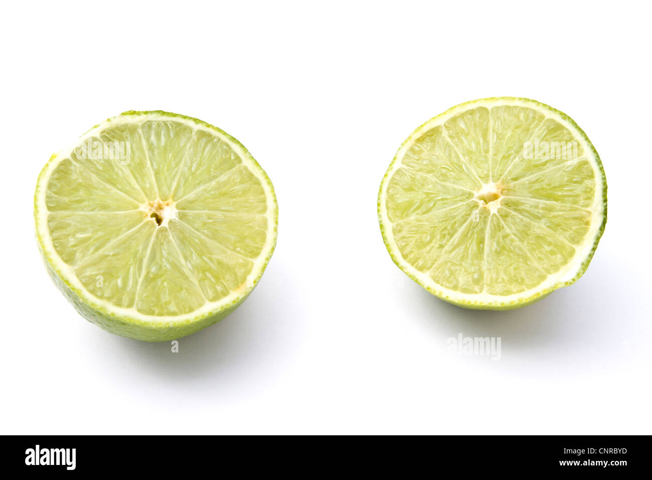 Fresh green lime closeup on white background Stock Photo - Alamy