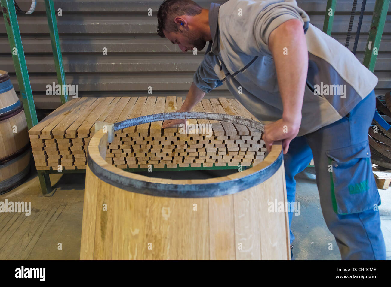 The hooping process with the barrel staves., Cooperage Damy Father and ...