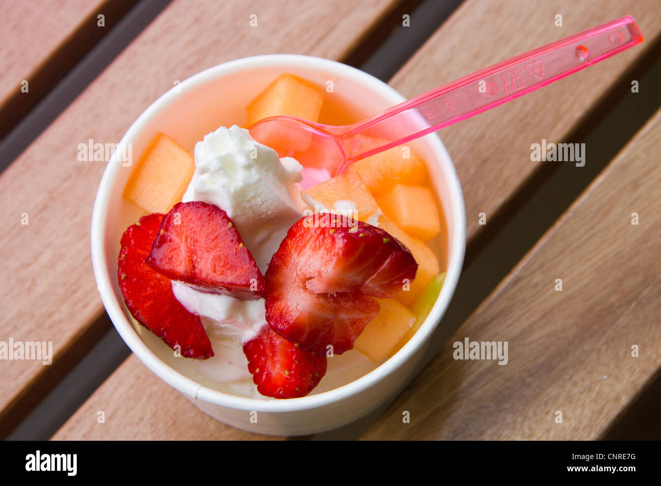 Delicious ice cream with strawberry and melon topping Stock Photo - Alamy