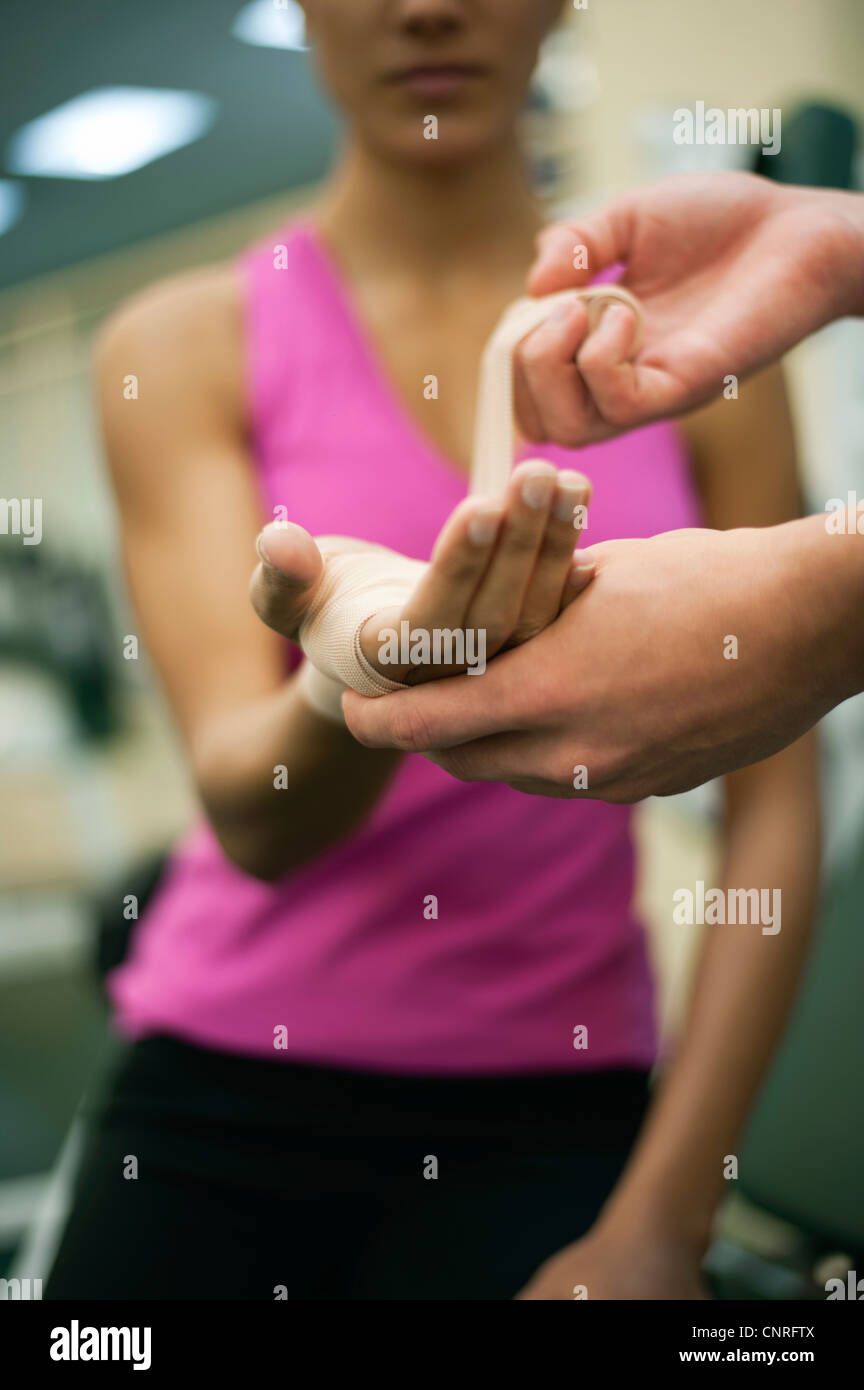 Woman wrapping hand bandage cropped hi-res stock photography and images ...