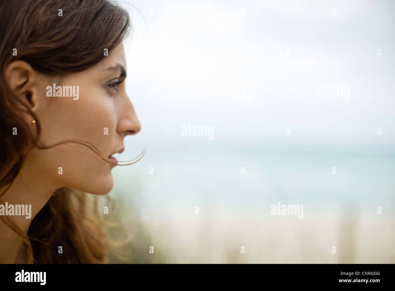 Profile of young woman outdoors Stock Photo - Alamy