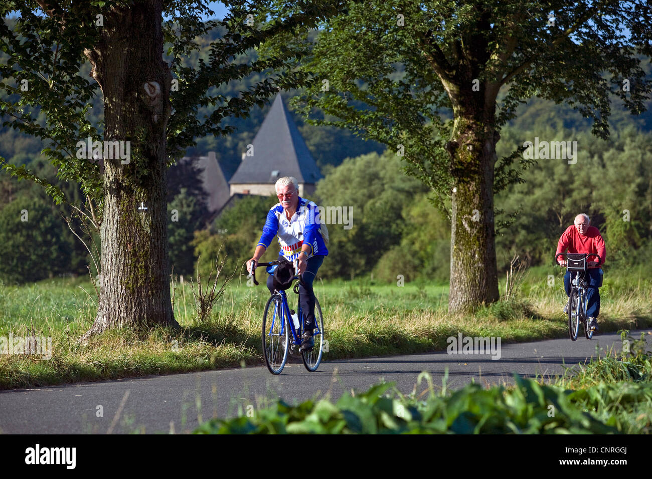 cyclists on the Ruhr Valley Cycleway in Hattingen, Kemnade Castle in ...