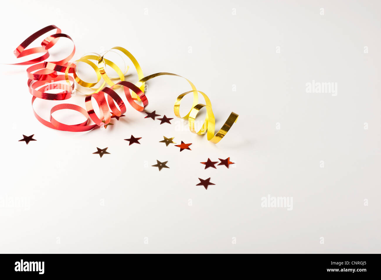 Confetti and gift-wrap ribbon Stock Photo - Alamy