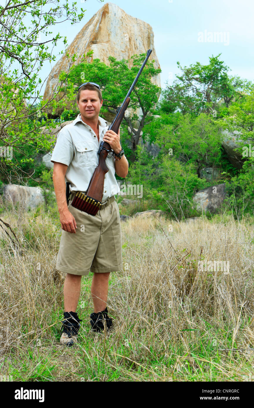 A game ranger on a walk through the Kruger National Park Stock Photo ...