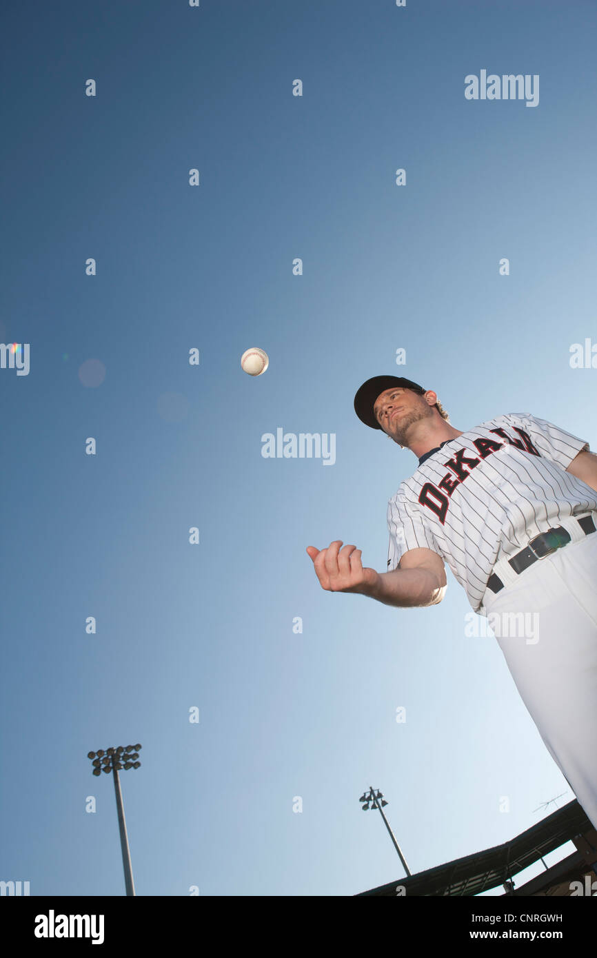 Baseball player catching ball Stock Photo - Alamy