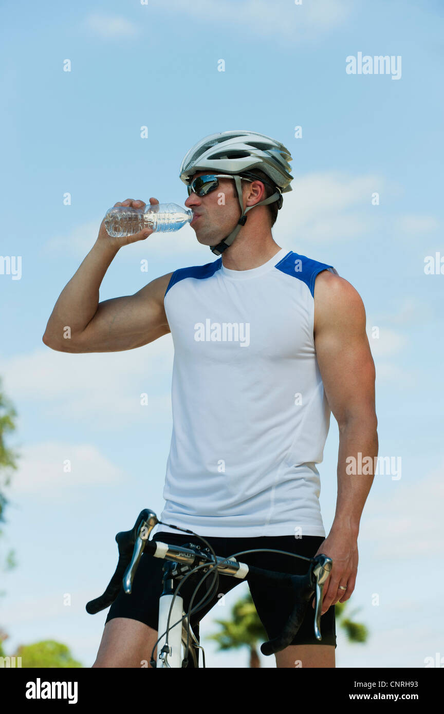 Cyclist drink bottle water, portrait Stock Photo - Alamy