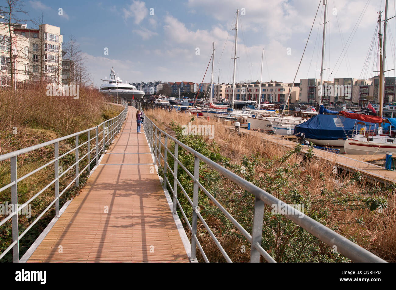 Walkway along Porto Quay in the Floating Harbour, City of Bristol, UK ...