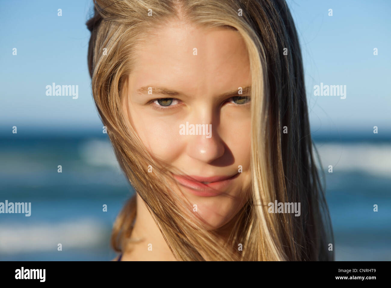 Young woman with tousled hair, portrait Stock Photo - Alamy