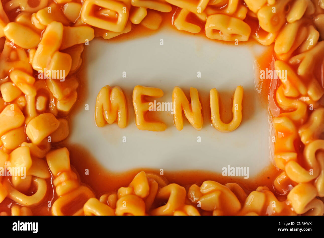 MENU spelled out with alphabet spaghetti Stock Photo - Alamy