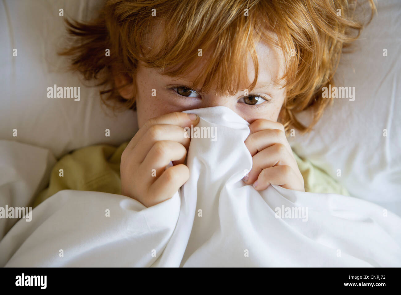Boy covering face with sheet, portrait Stock Photo - Alamy